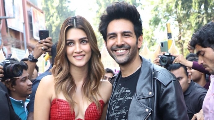Actors Kartik Aaryan & Kriti Sanon at the trailer launch of their upcoming film Shehzada in ...