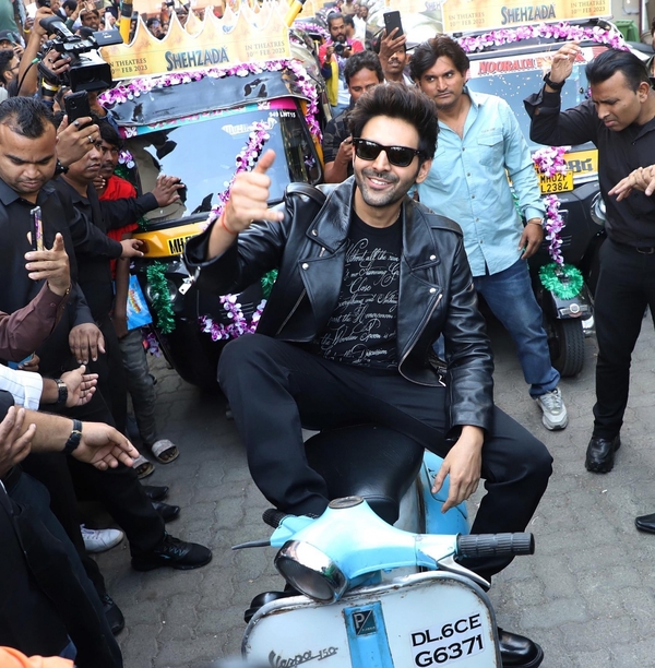 Actors Kartik Aaryan & Kriti Sanon at the trailer launch of their upcoming film Shehzada in ...