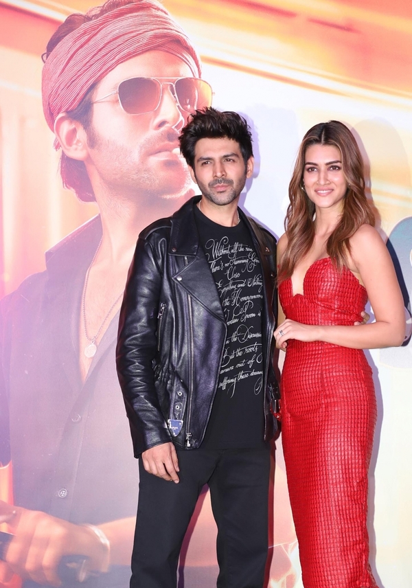 Actors Kartik Aaryan & Kriti Sanon at the trailer launch of their upcoming film Shehzada in ...